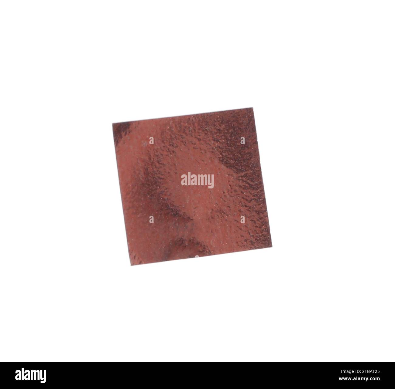 Piece of bronze confetti isolated on white Stock Photo - Alamy