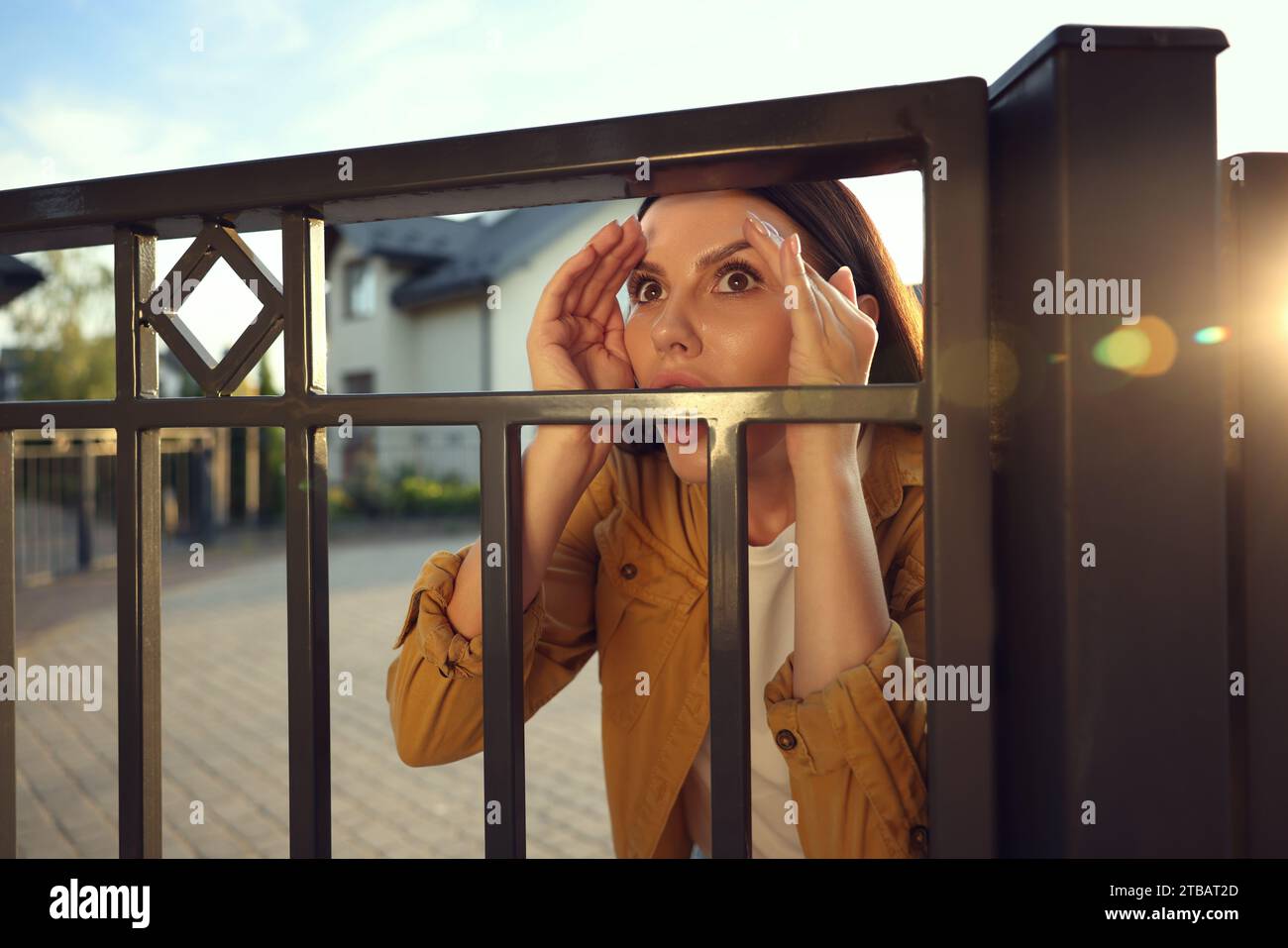 Concept Of Private Life Curious Woman Spying On Neighbours Over Fence