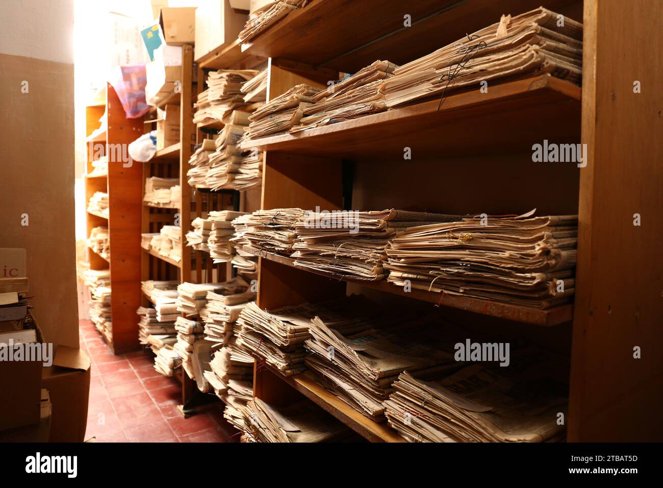 Collection of old newspapers on shelves in library Stock Photo - Alamy