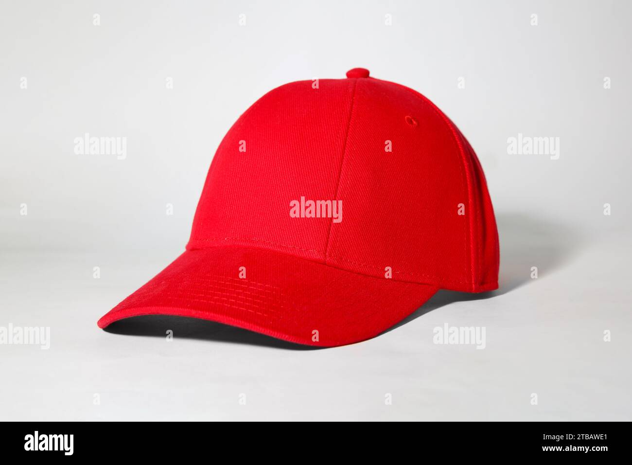 Stylish red baseball cap on white background Stock Photo - Alamy