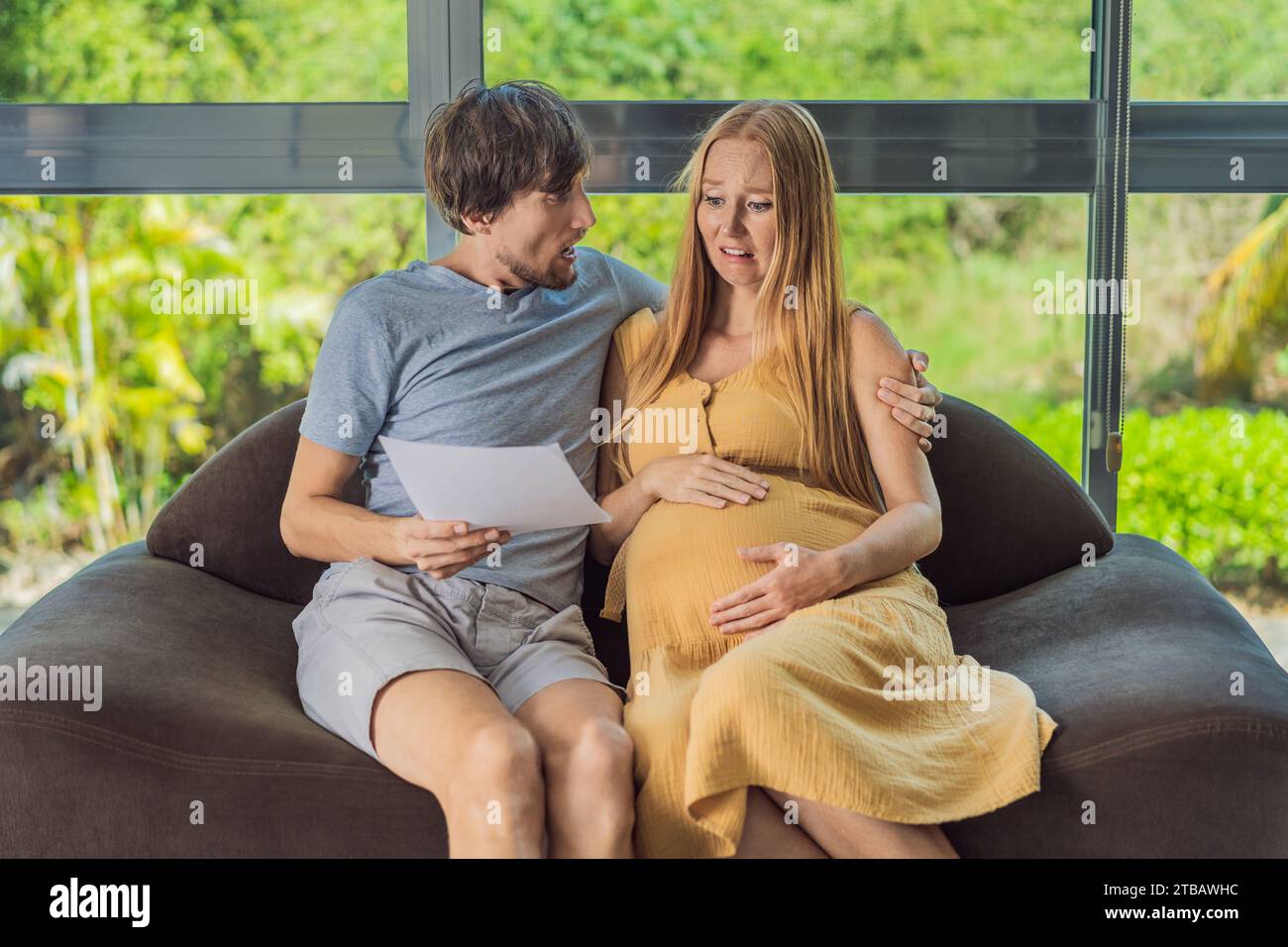 Cost of Pregnancy And Family Budgeting Concept. Young couple expecting ...