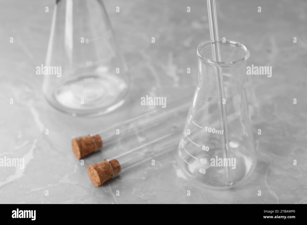 Different laboratory glassware on grey marble table, closeup Stock ...