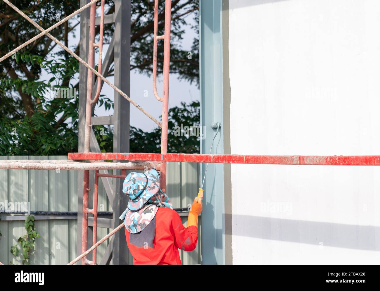 Painter is painting a steel H-beam of steel structure work with paint ...