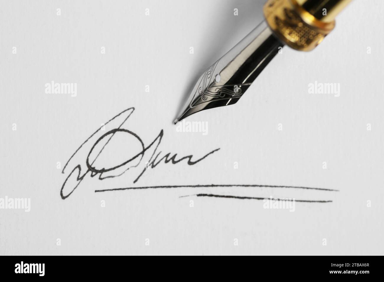 Signing on sheet of paper with fountain pen, closeup Stock Photo - Alamy