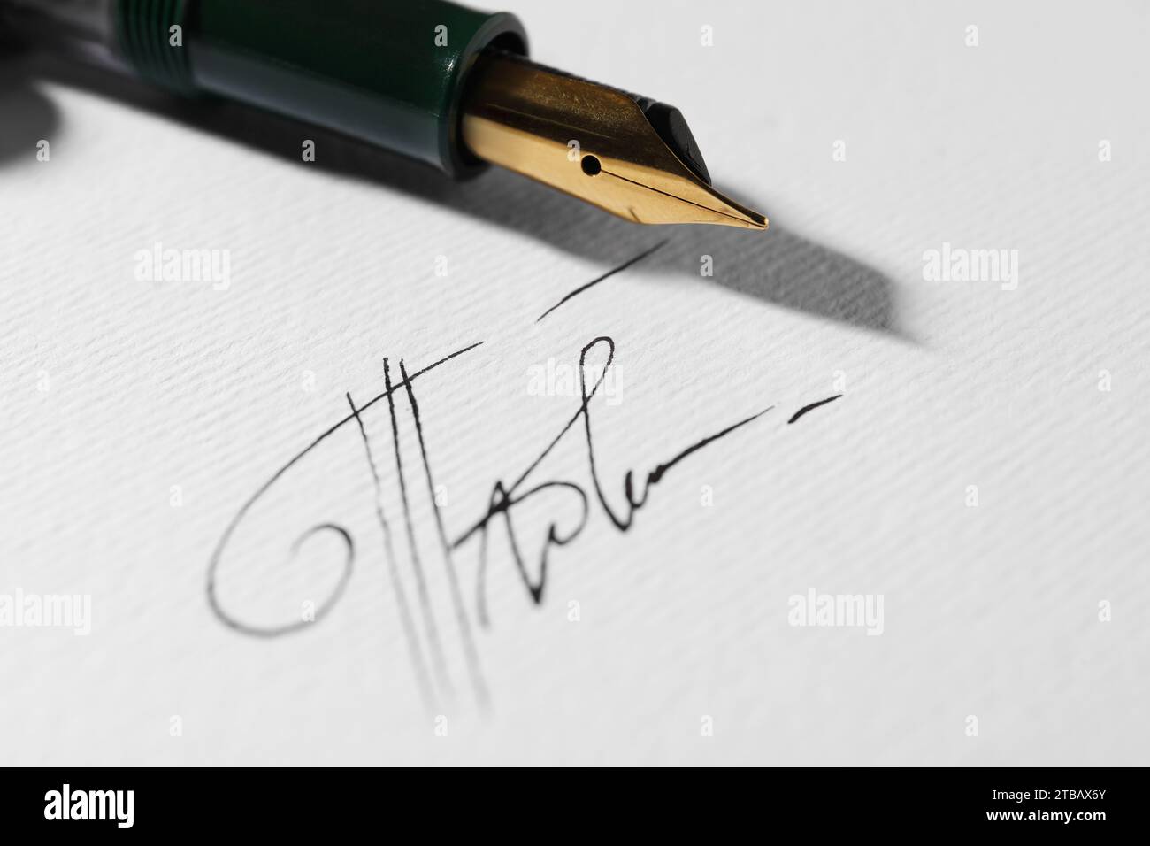 Sheet of paper with fountain pen and signature, closeup Stock Photo - Alamy