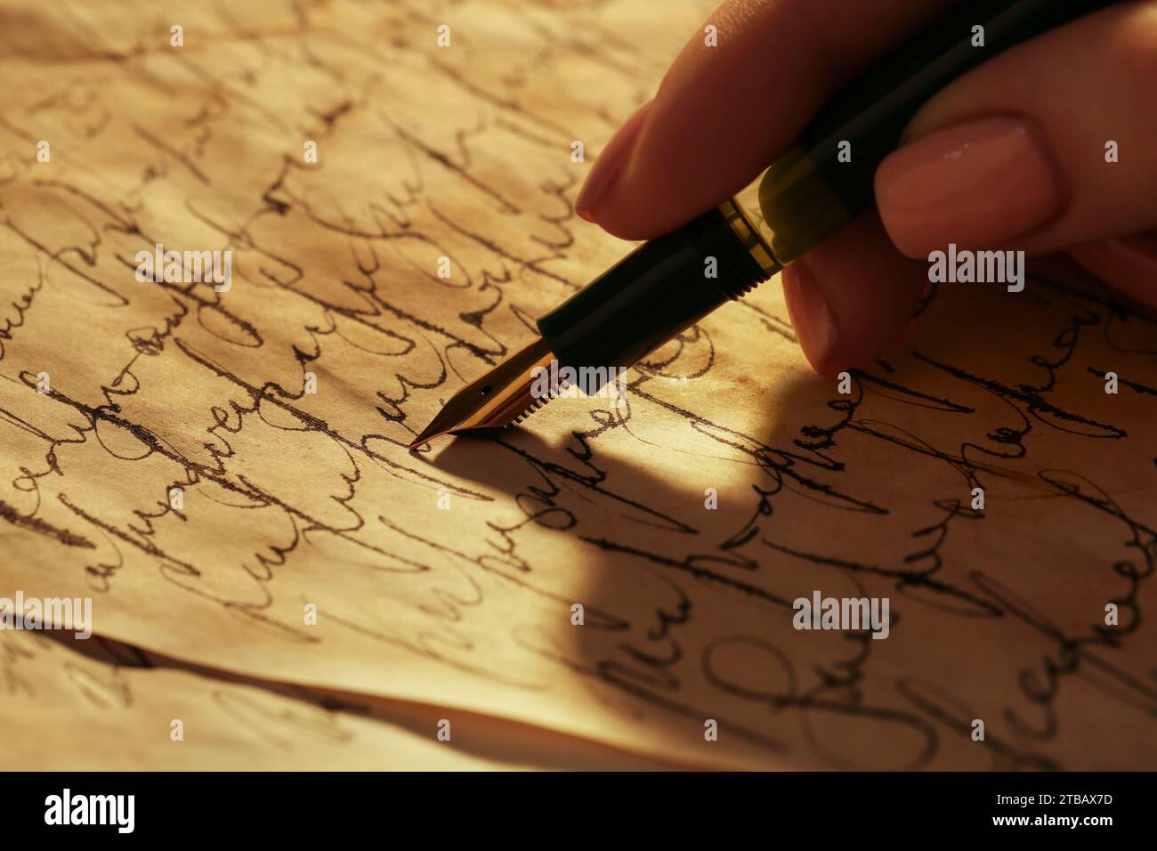 Woman writing letter with fountain pen, closeup Stock Photo - Alamy