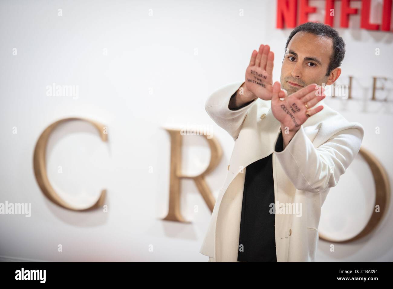 London, UK. 05th Dec, 2023. Khalid Abdalla holds his hands up with ...