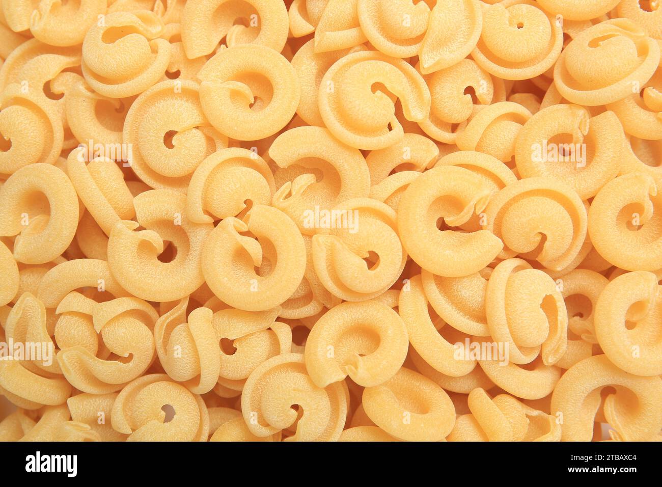 Raw dischi volanti pasta as background, top view Stock Photo - Alamy