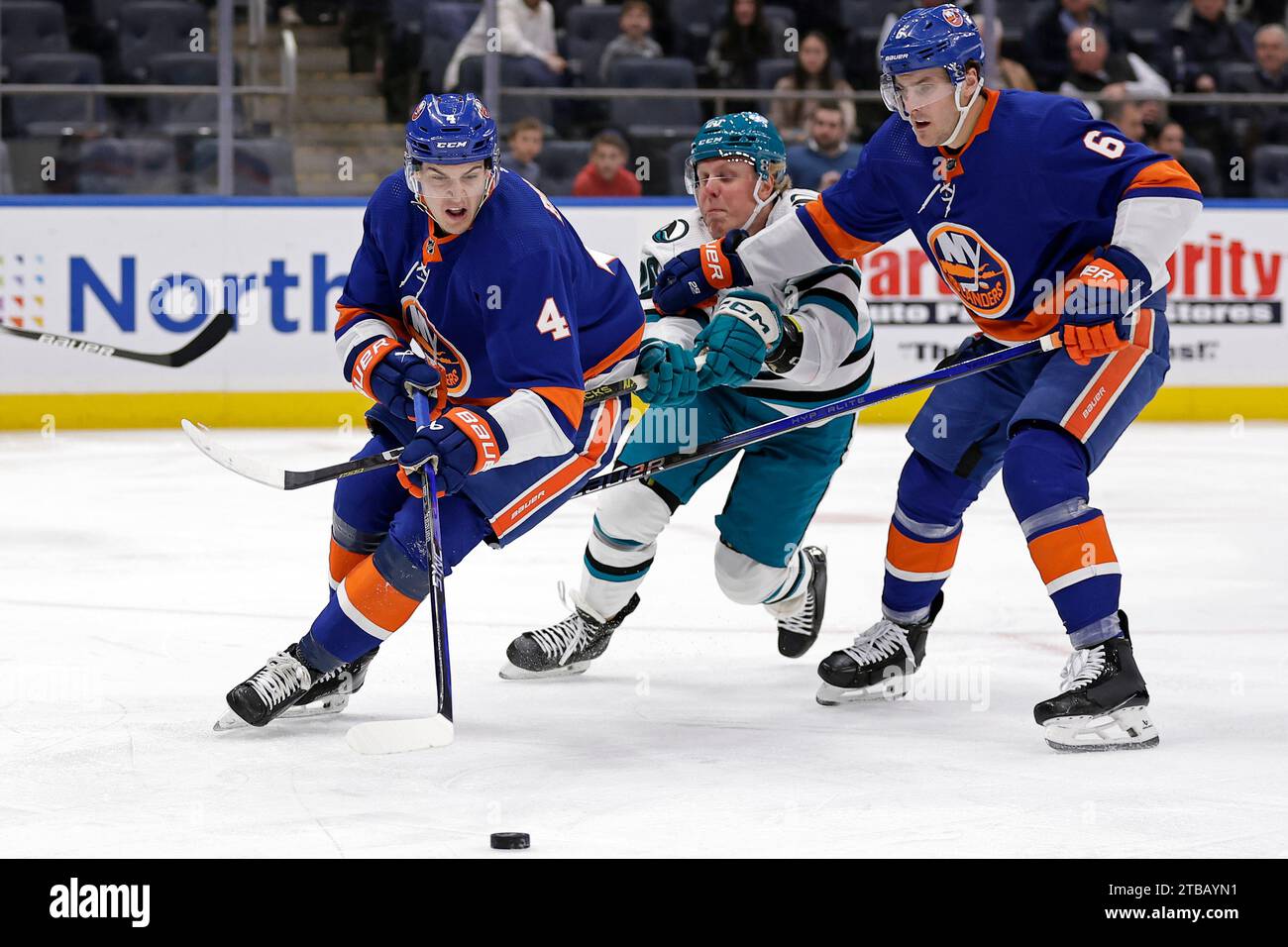New York Islanders defenseman Samuel Bolduc (4) skates with the puck as ...