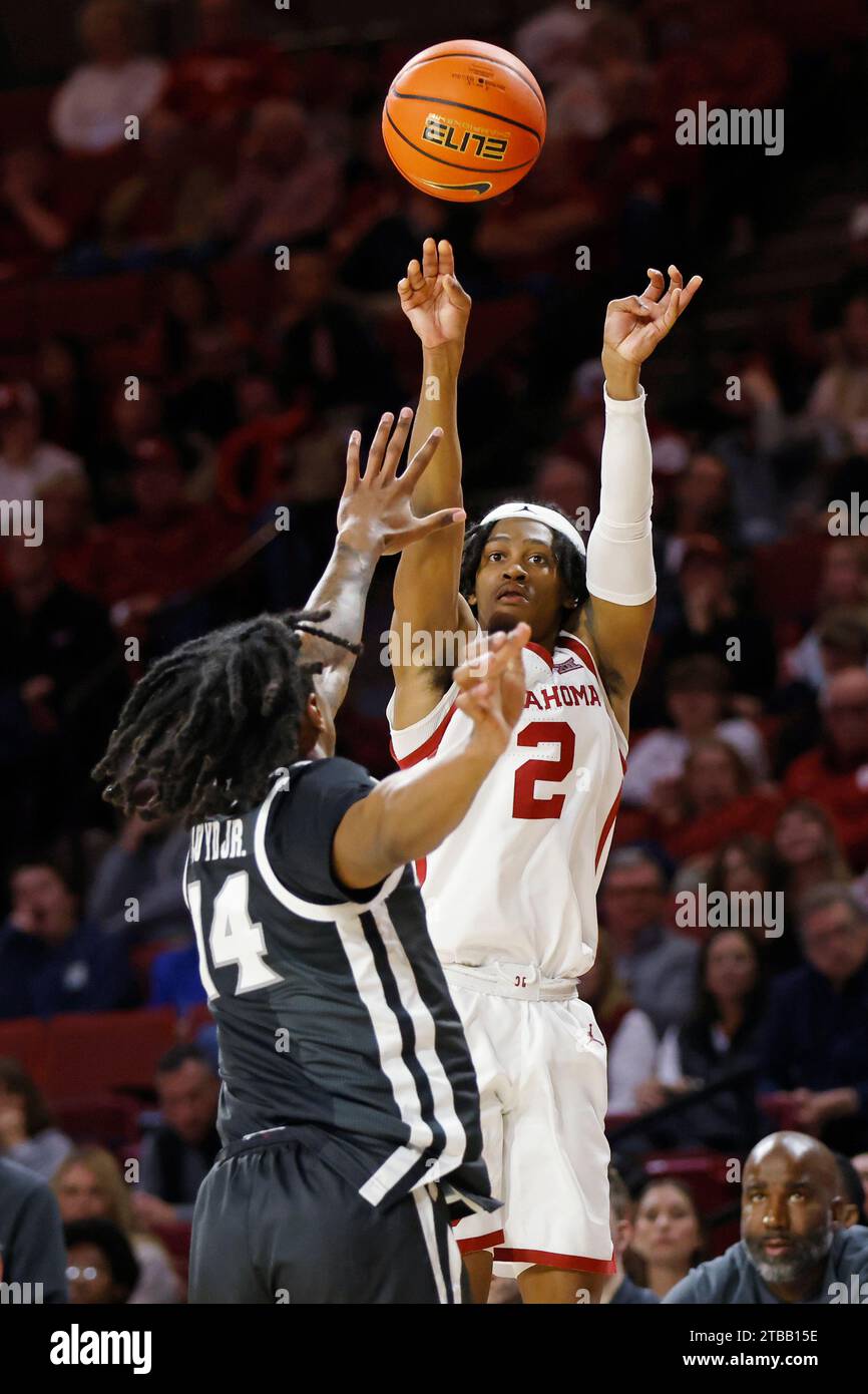 Oklahoma guard Javian McCollum (2) shoots over Providence guard Corey ...
