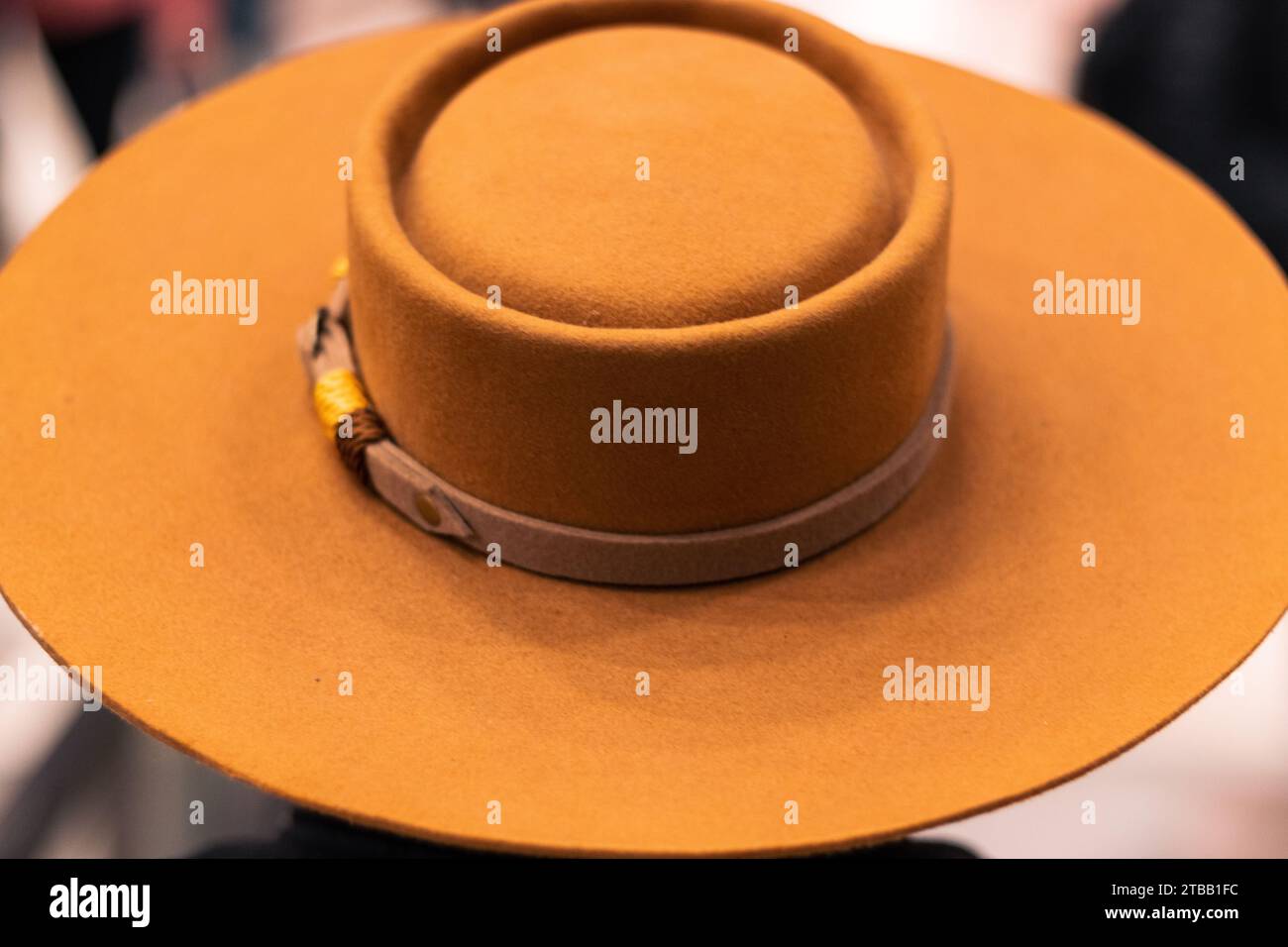 classic yellow cowboy hat with back view, very colorful in the city ...