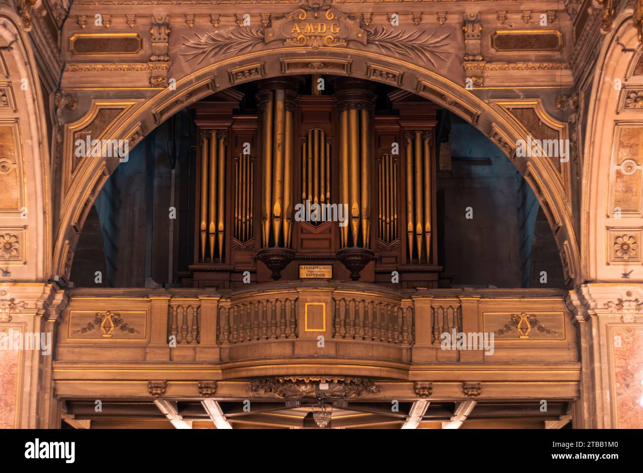 Classic golden organ in a cathedral church with traditional decoration ...