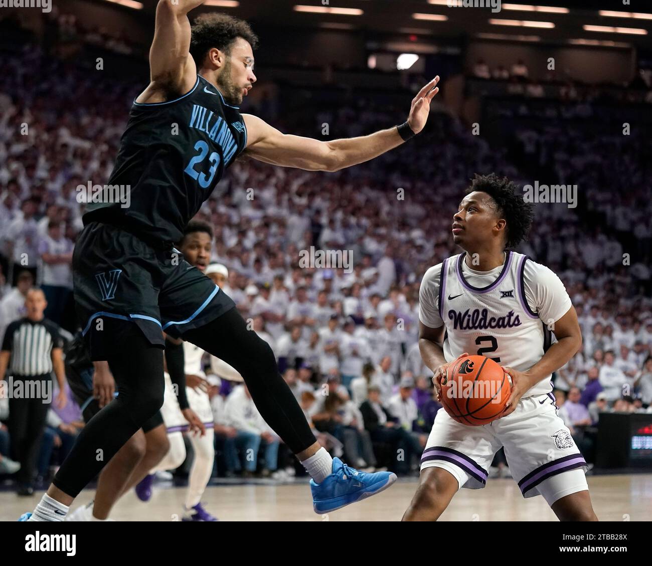 Kansas State guard Tylor Perry (2) looks to shoot under pressure from ...