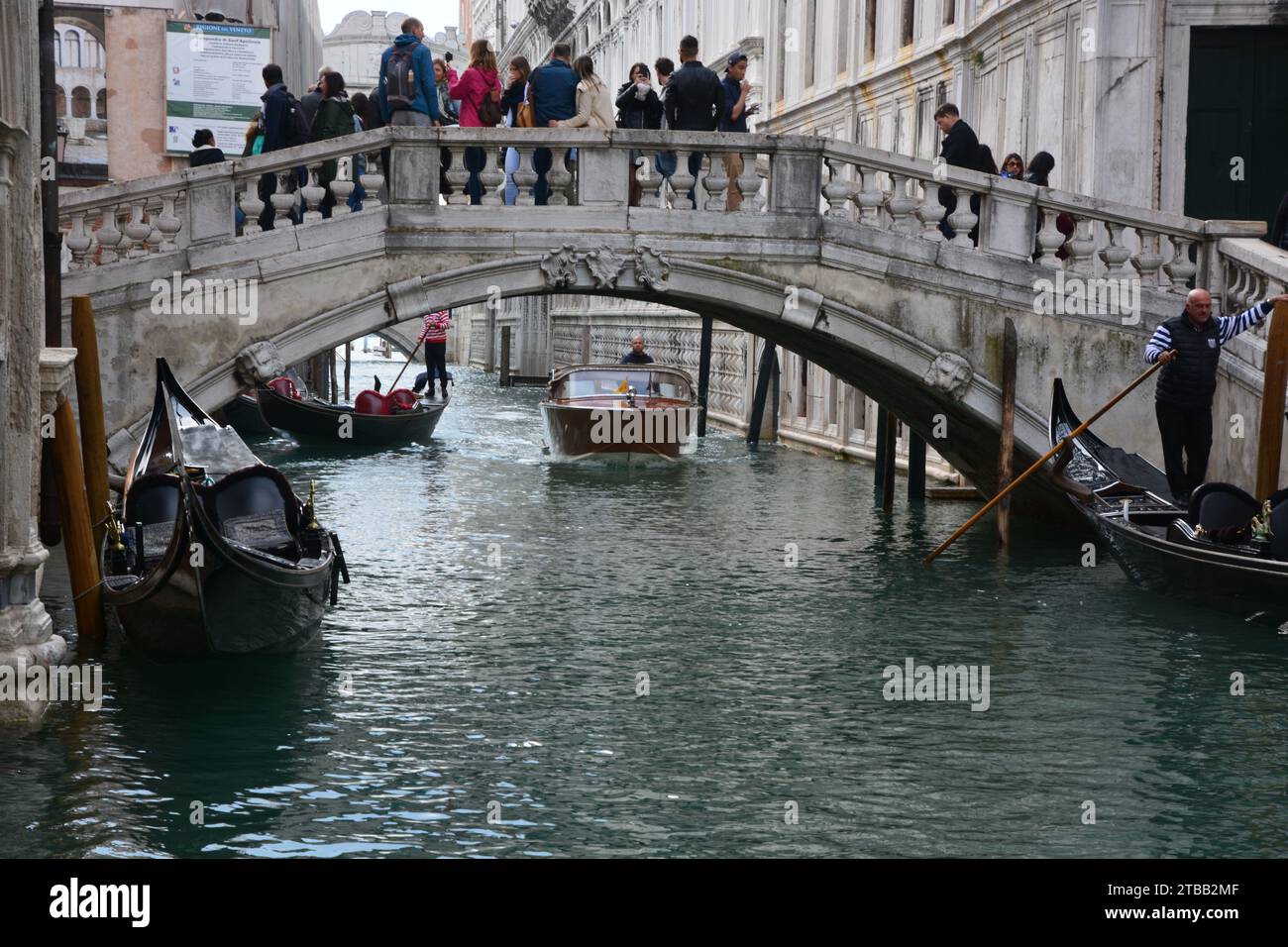 Water Taxi and Gondola's passing under the bridges on the canal in ...