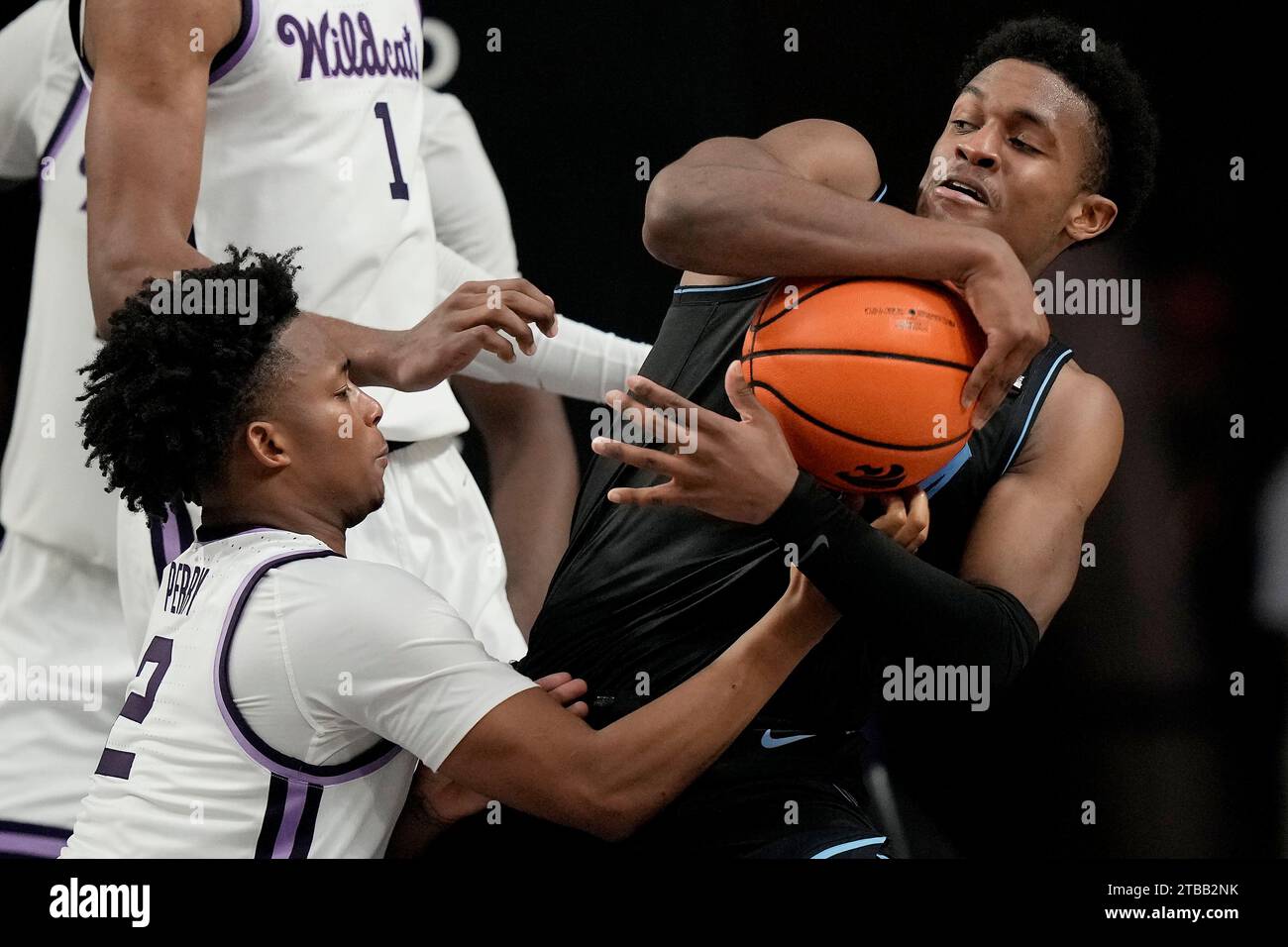 Kansas State guard Tylor Perry (2) tries to steal the ball from ...
