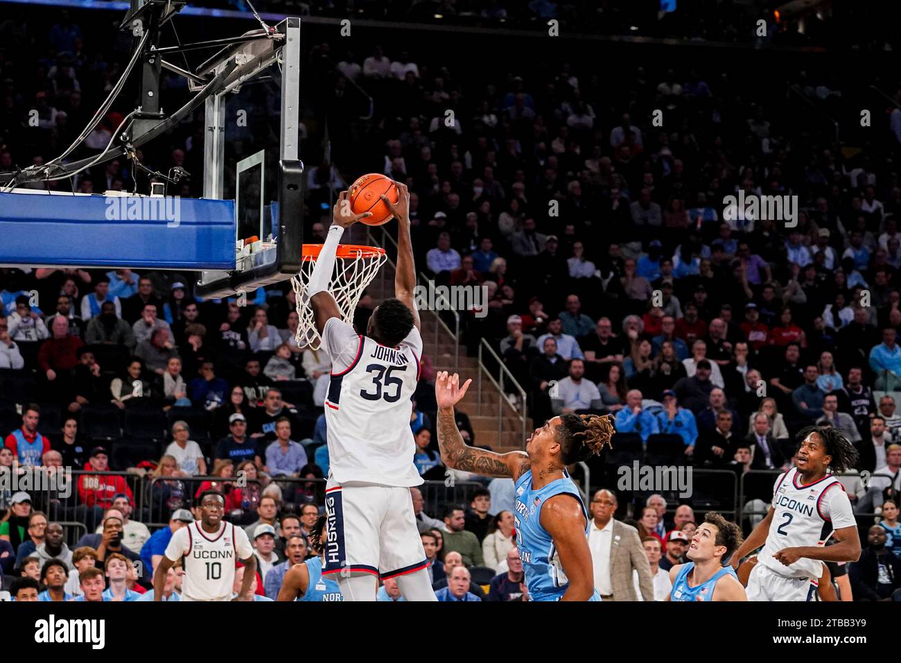 UConn forward Samson Johnson (35) dunks the ball during the first half ...