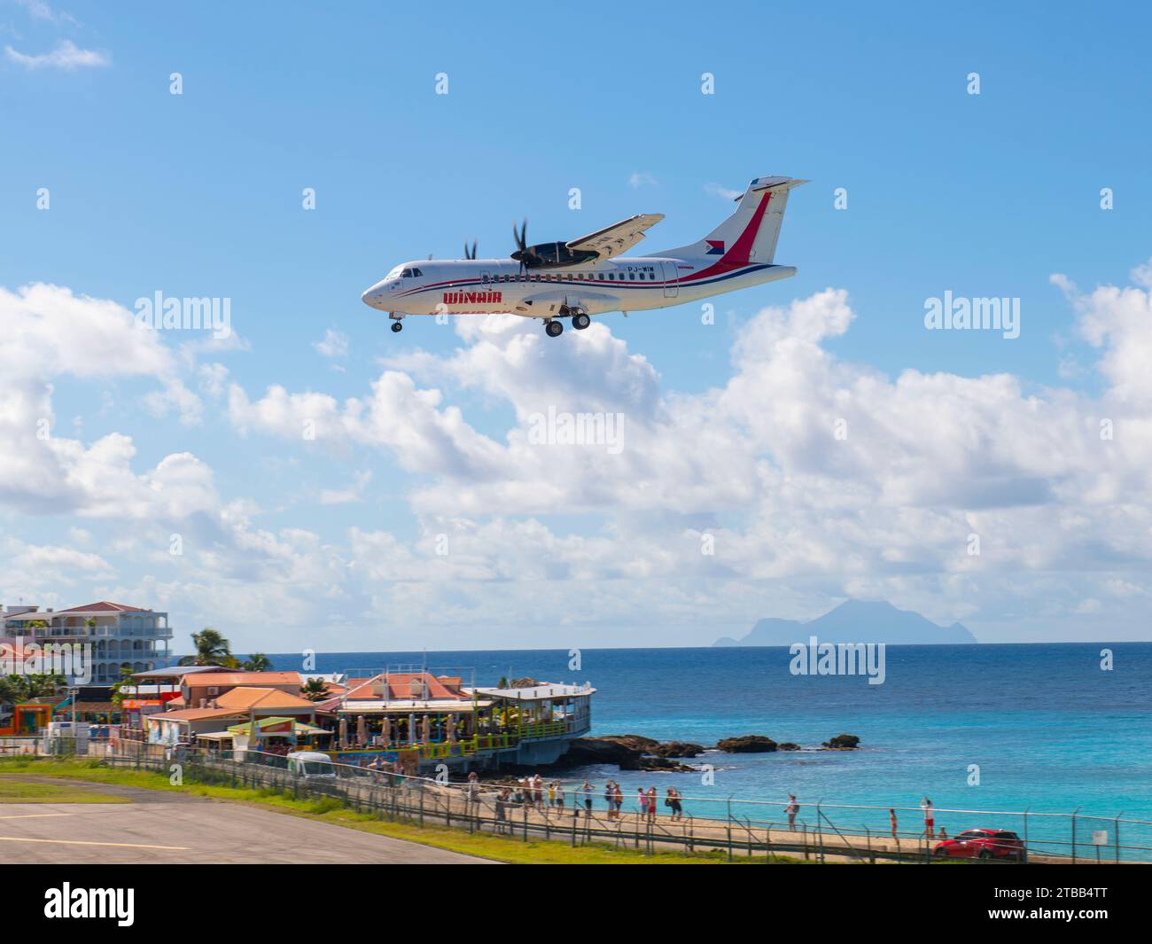 Winair (Windward Islands Airways) ATR 42 flying over Maho Beach before ...