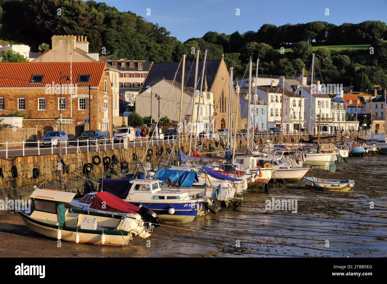St Aubin: Yachts and boats moored in harbour soon after sunrise, with ...