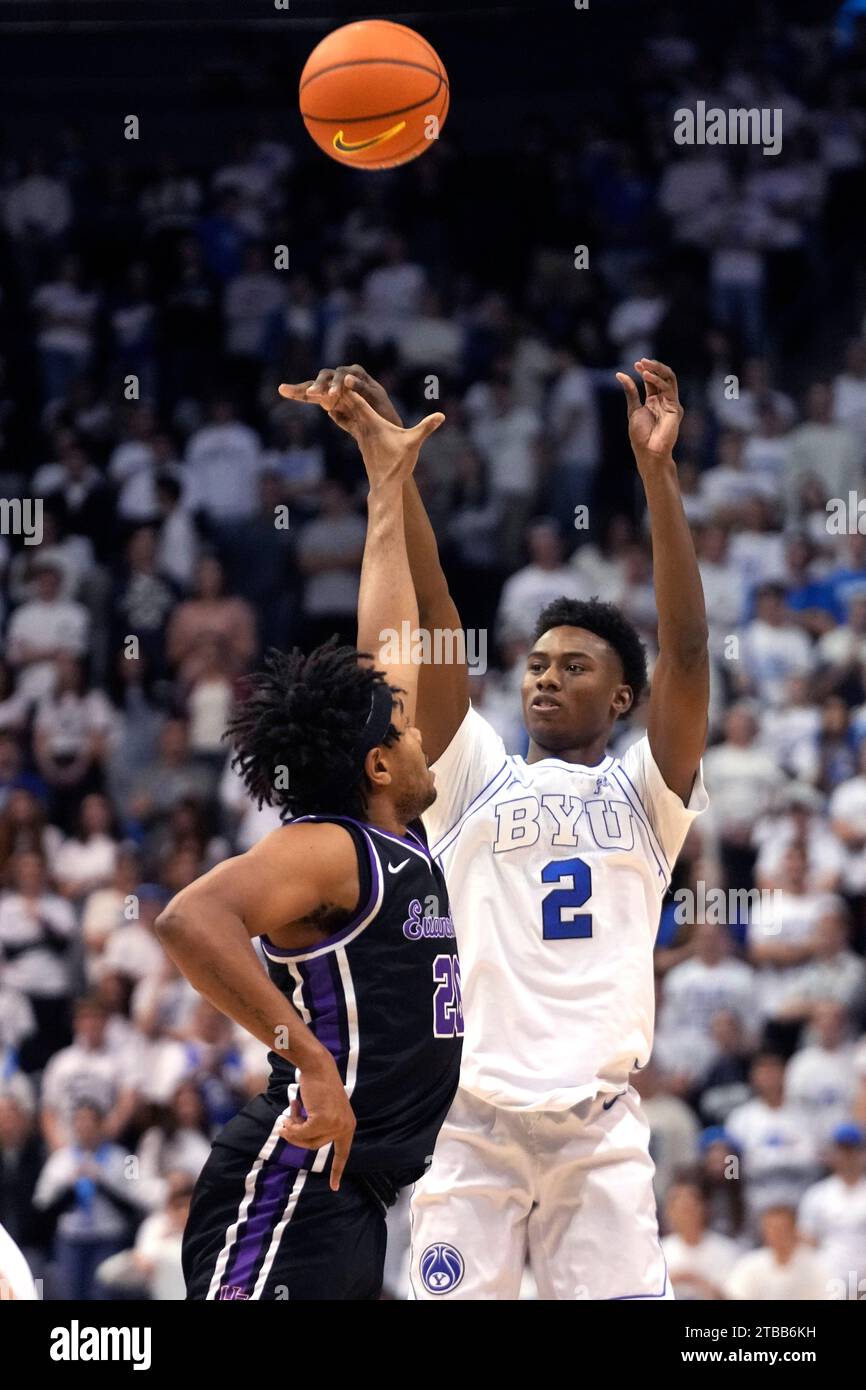 BYU guard Jaxson Robinson (2) shoots as Evansville guard Kenny ...