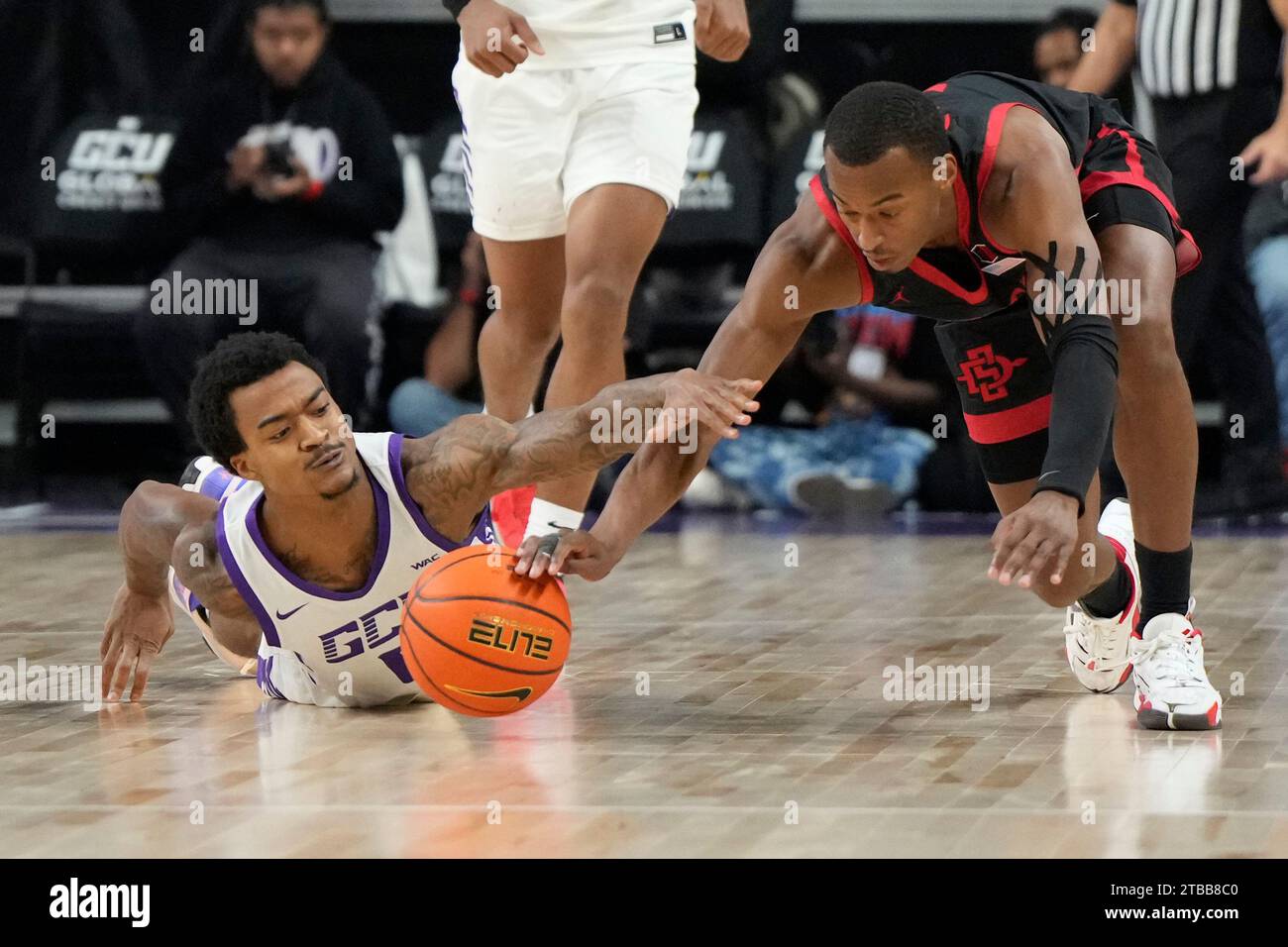 Grand Canyon guard Ray Harrison, left and San Diego State guard Micah ...