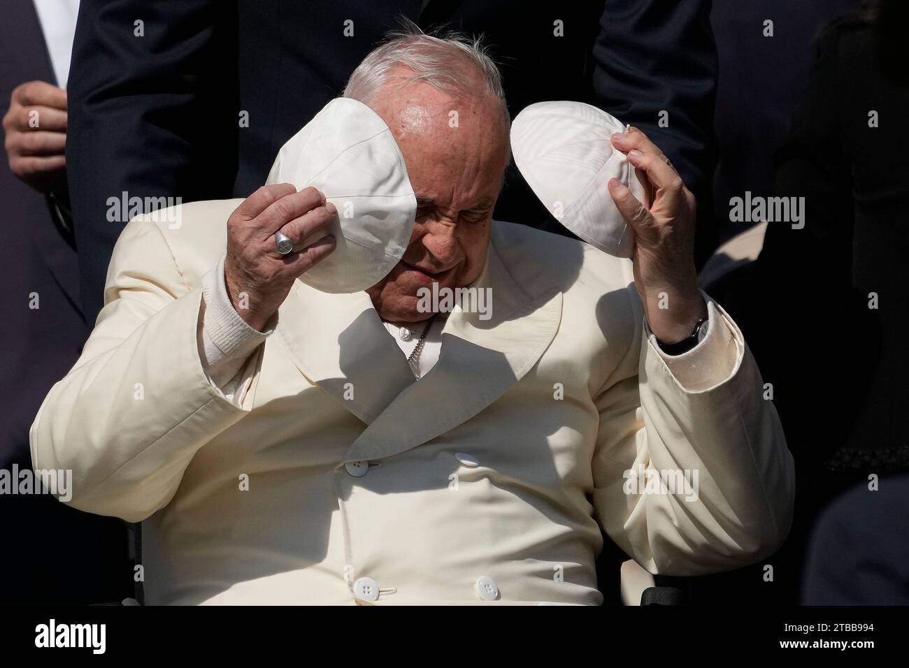 Pope Francis exchanges his skull cap with one presented by a ...