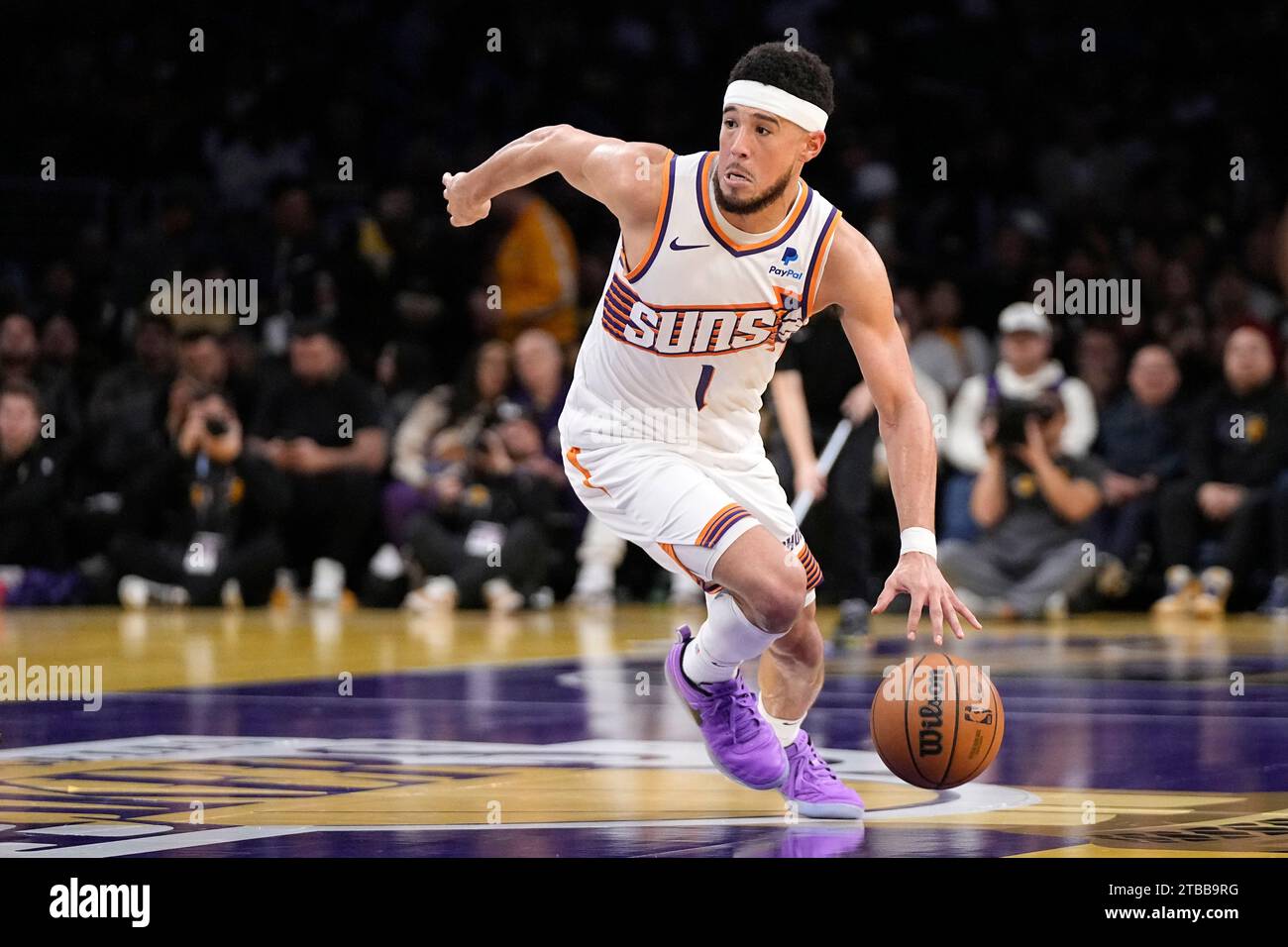Phoenix Suns guard Devin Booker drives toward the basket during the ...