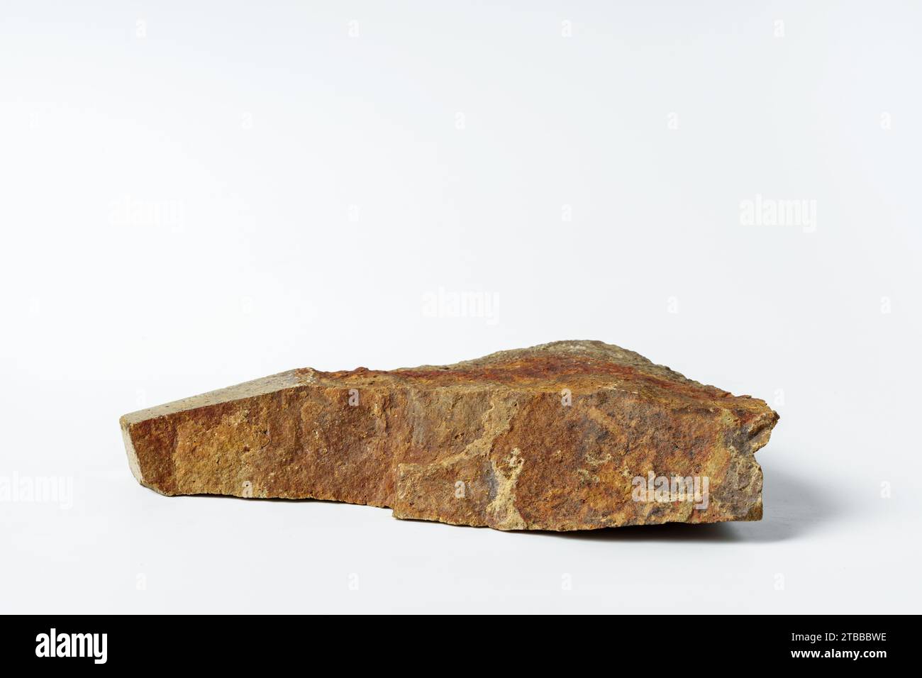Piece of granite stone isolated on white background Stock Photo - Alamy