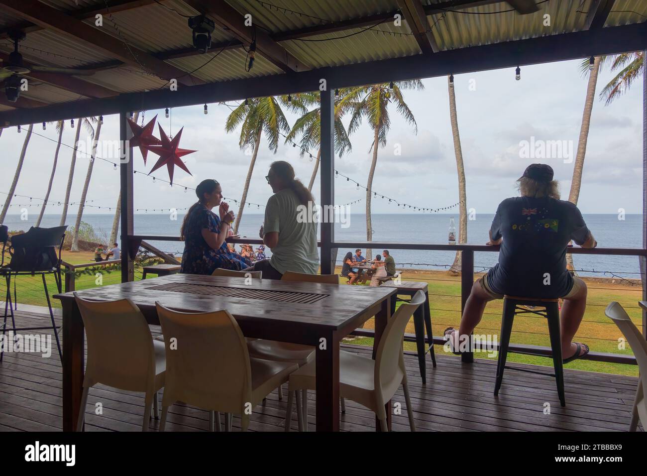 People enjoying a relaxed drink on the terrace of the Rumah Tinggi ...