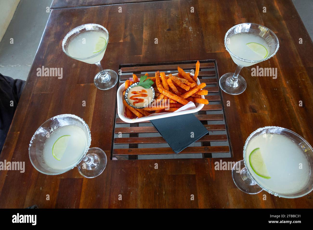 Margarita cocktails and sweet potato chips served at the Rumah Tinggi ...