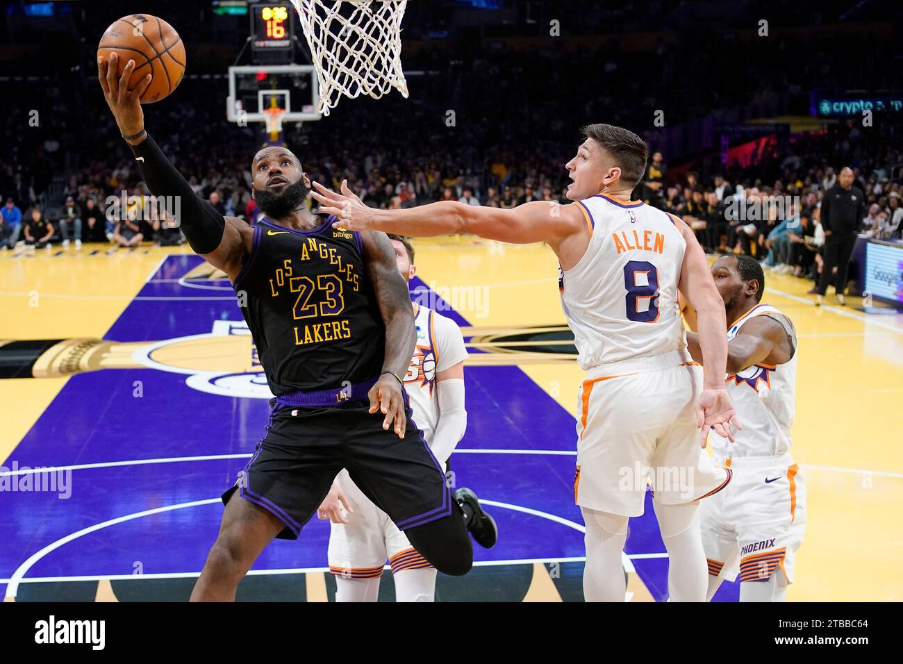 Los Angeles Lakers forward LeBron James, left, shoots as Phoenix Suns ...