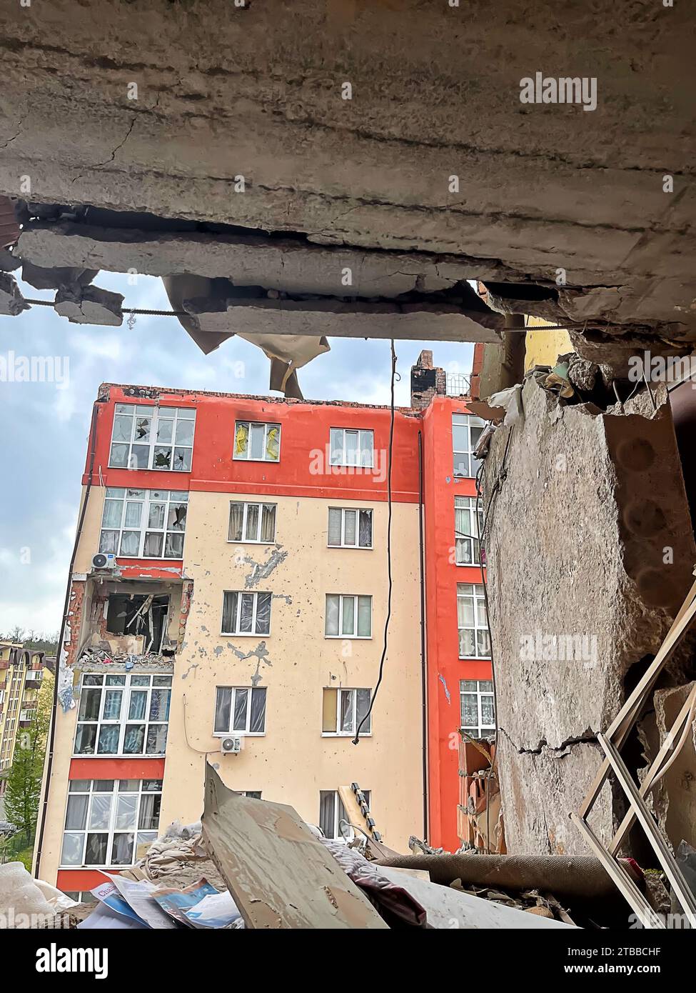 Irpen, Ukraine. May 07. 2022 View of a neighboring house from a ruined ...