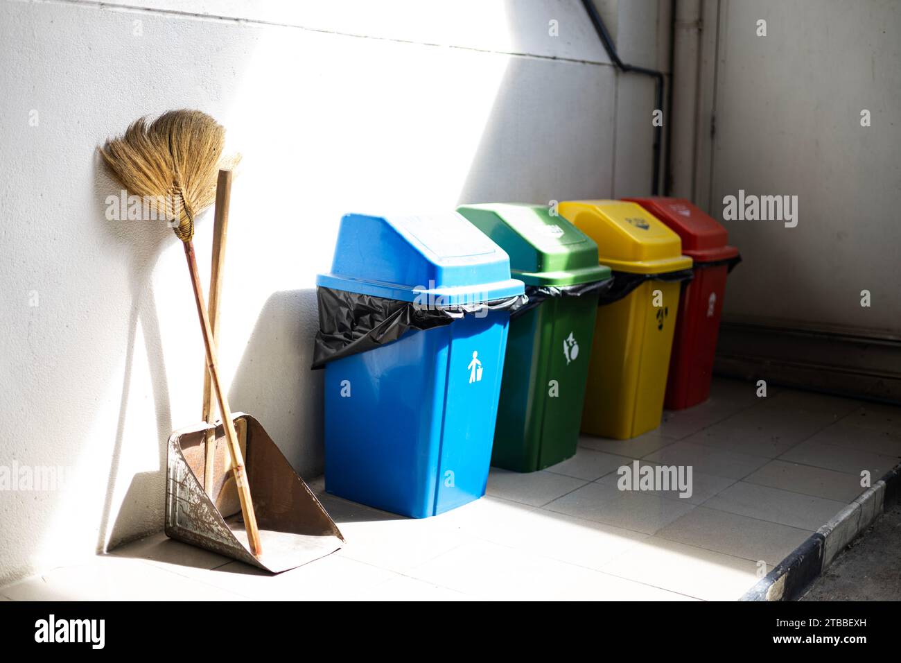 Multicolored Garbage Trash Bins. Recycling bins at a recycling station ...