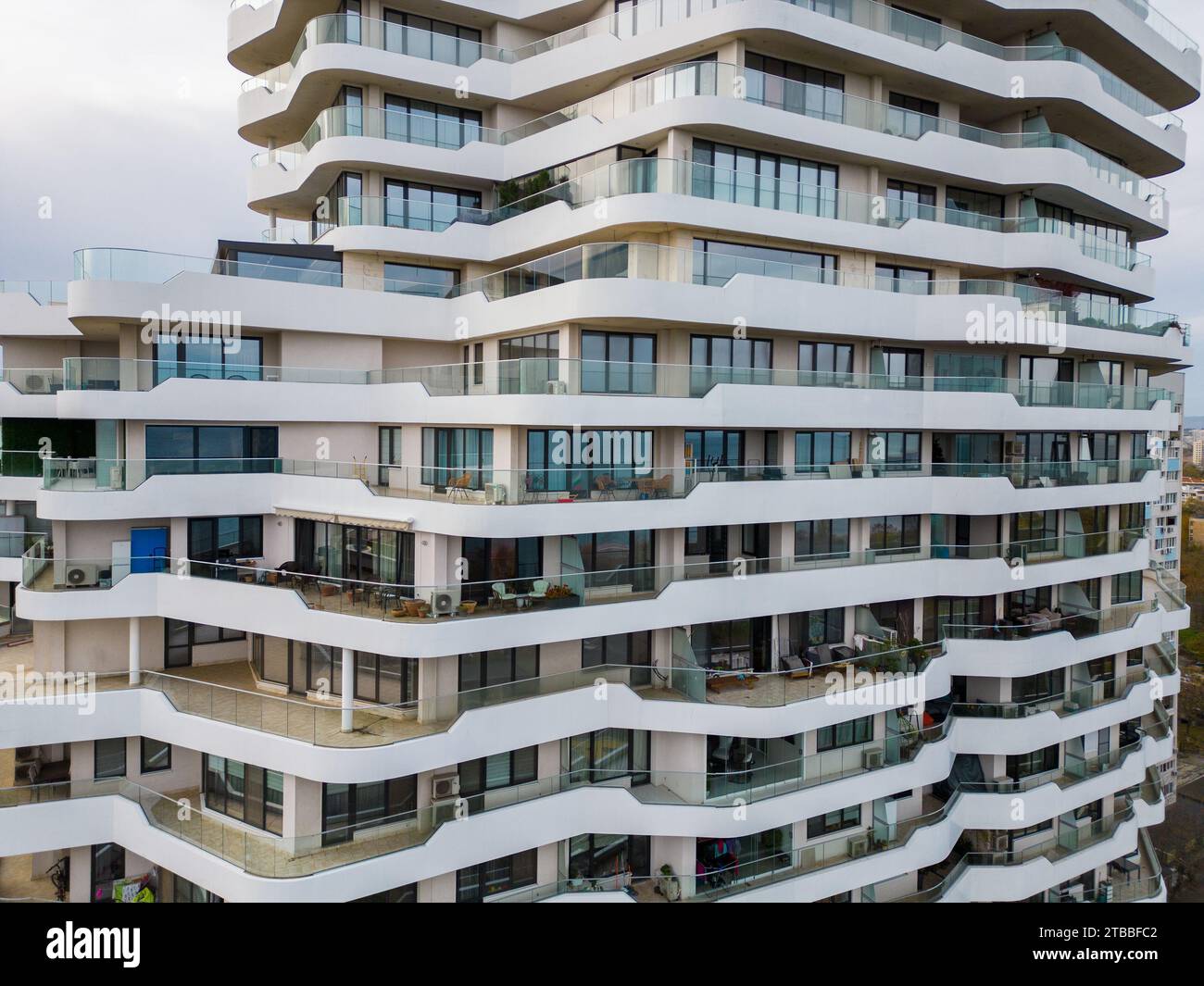 Drone flight along the facade of a modern office or residential ...