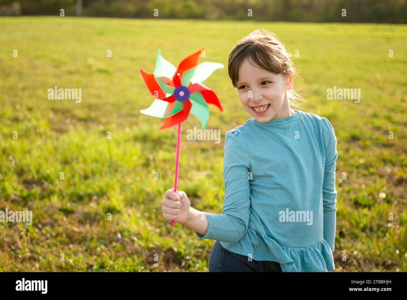 Girl with a pinwheel hi-res stock photography and images - Alamy