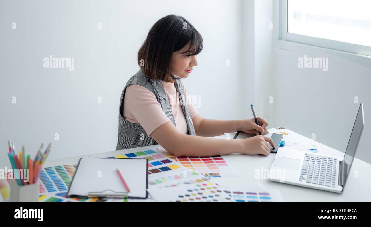 Designer using laptop to design fashion clothes. Fashion Design Concept ...