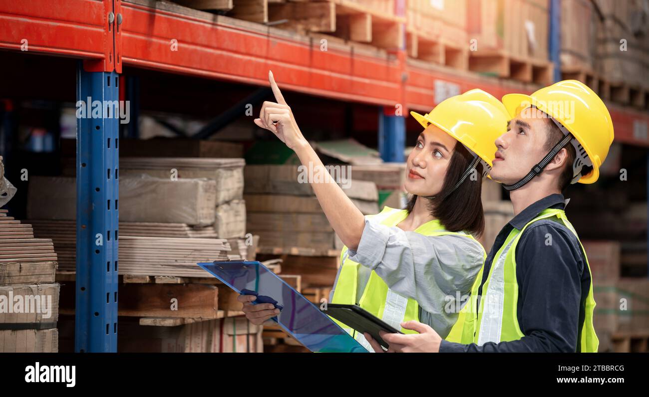 Warehouse worker checking controlling packages hi-res stock photography ...