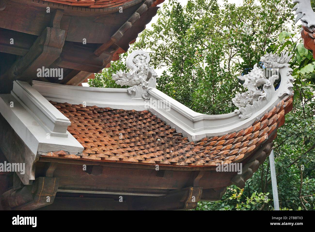 Detail of Buddhist temple architecture with massive carved wooden beams ...