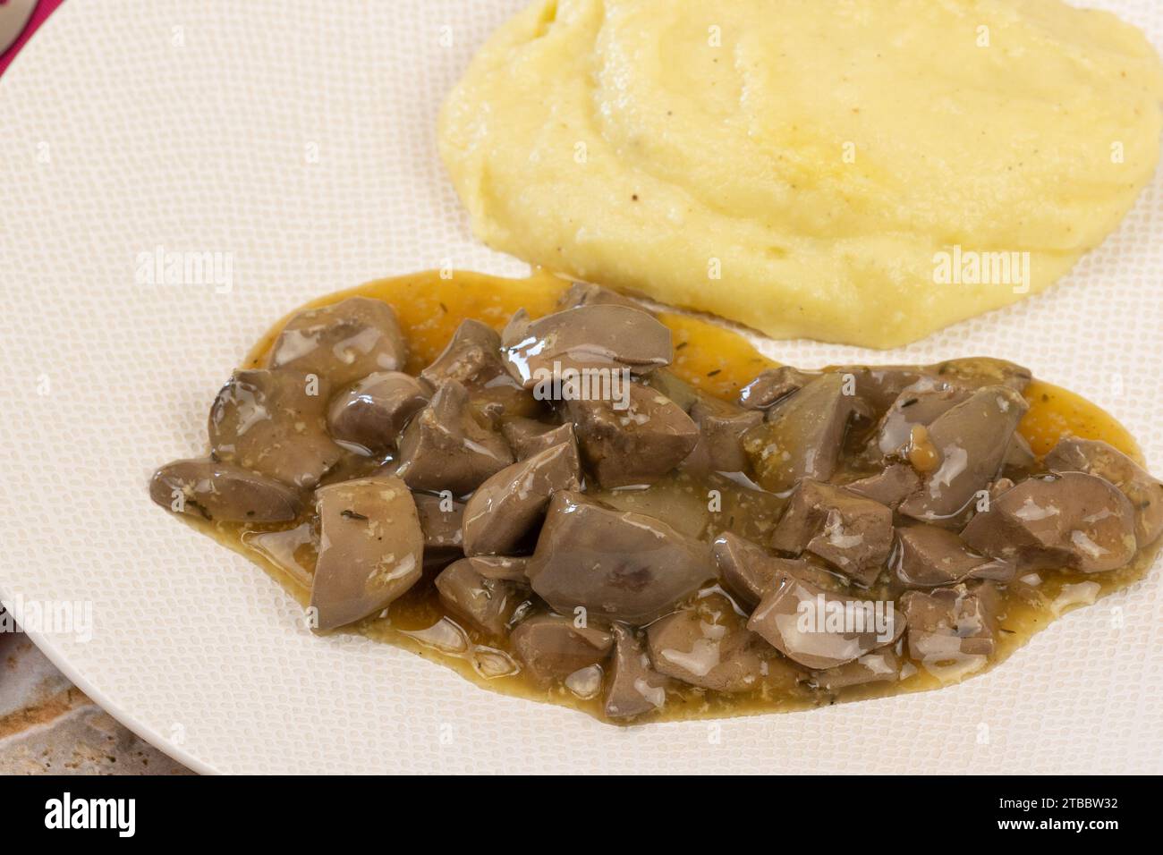 cooked pork kidneys, close-up, accompanied by mash Stock Photo - Alamy