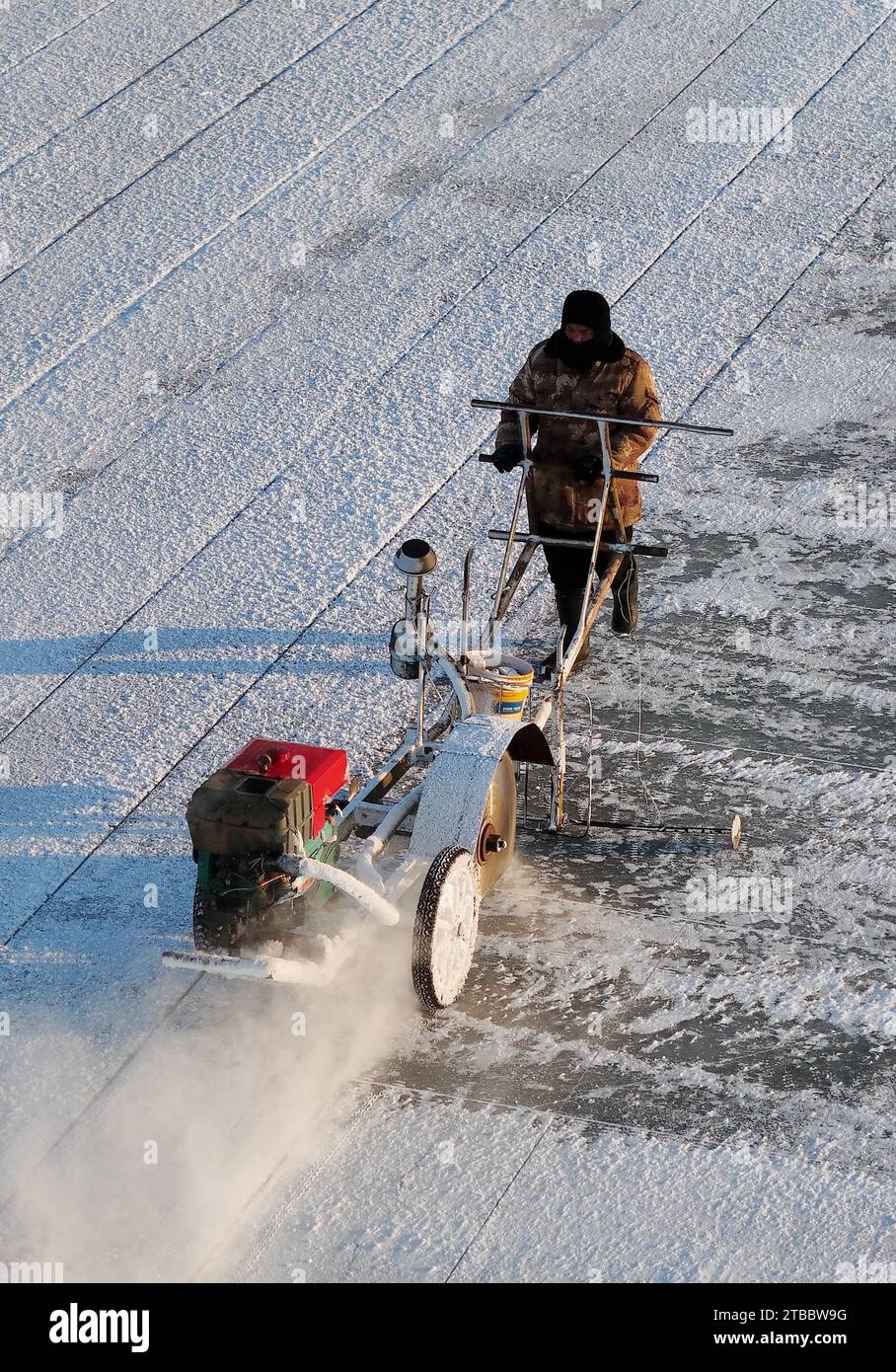 Aerial photo shows workers cutting ice lines to mine ice on Songhua ...