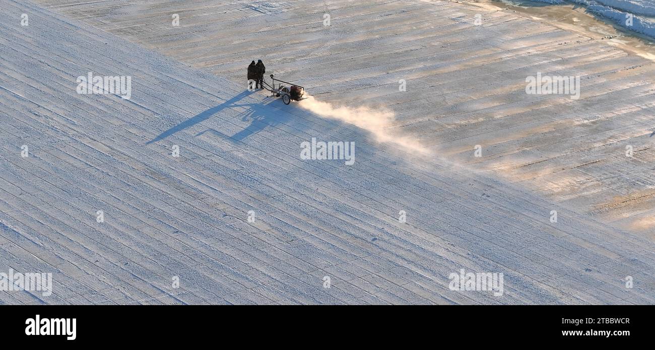 Aerial photo shows workers cutting ice lines to mine ice on Songhua ...