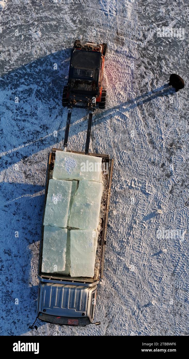 Aerial photo shows workers cutting ice lines to mine ice on Songhua ...