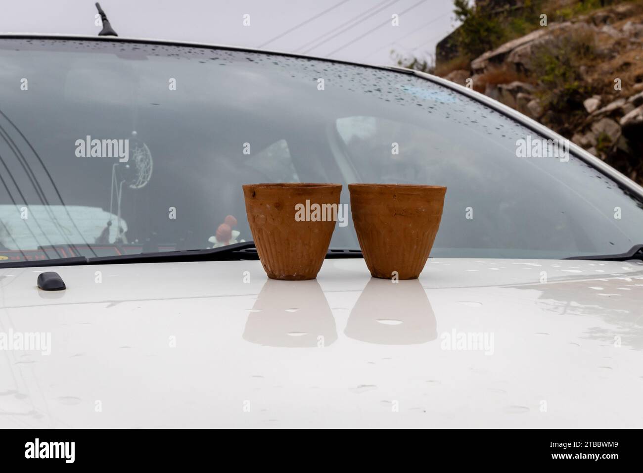 hot tea served in traditional handleless pottery clay cup kept at car ...