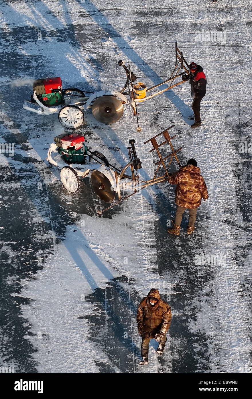 Aerial photo shows workers cutting ice lines to mine ice on Songhua ...
