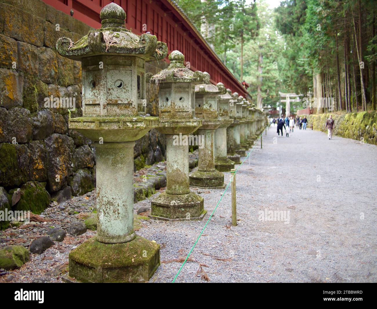 Stone lanterns outside the Futarasan Jinja shrine in Nikko, Japan. This ...
