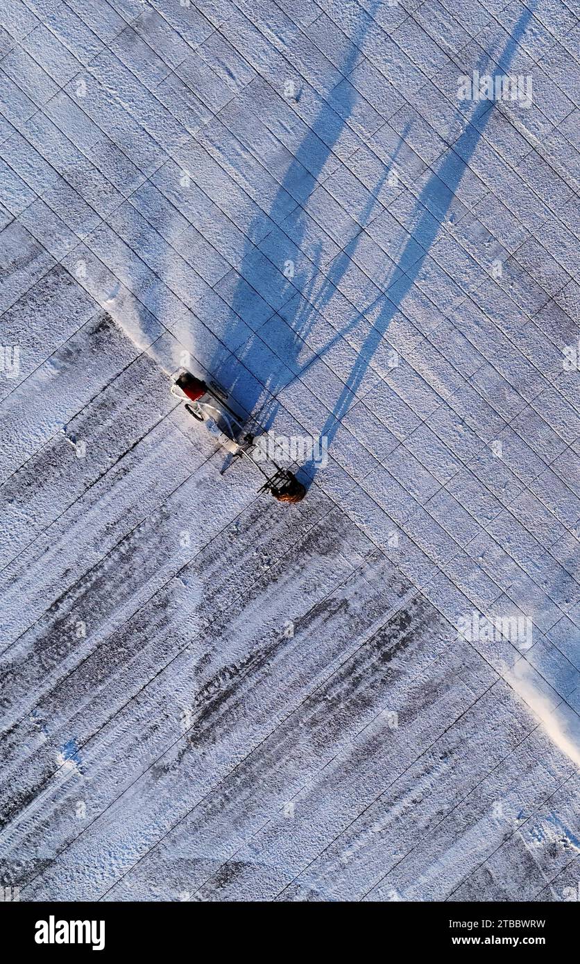 Aerial photo shows workers cutting ice lines to mine ice on Songhua ...