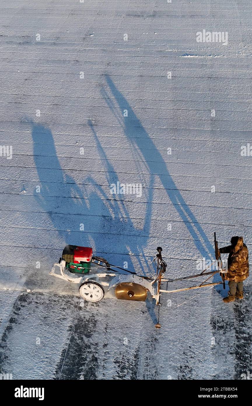 Aerial photo shows workers cutting ice lines to mine ice on Songhua ...