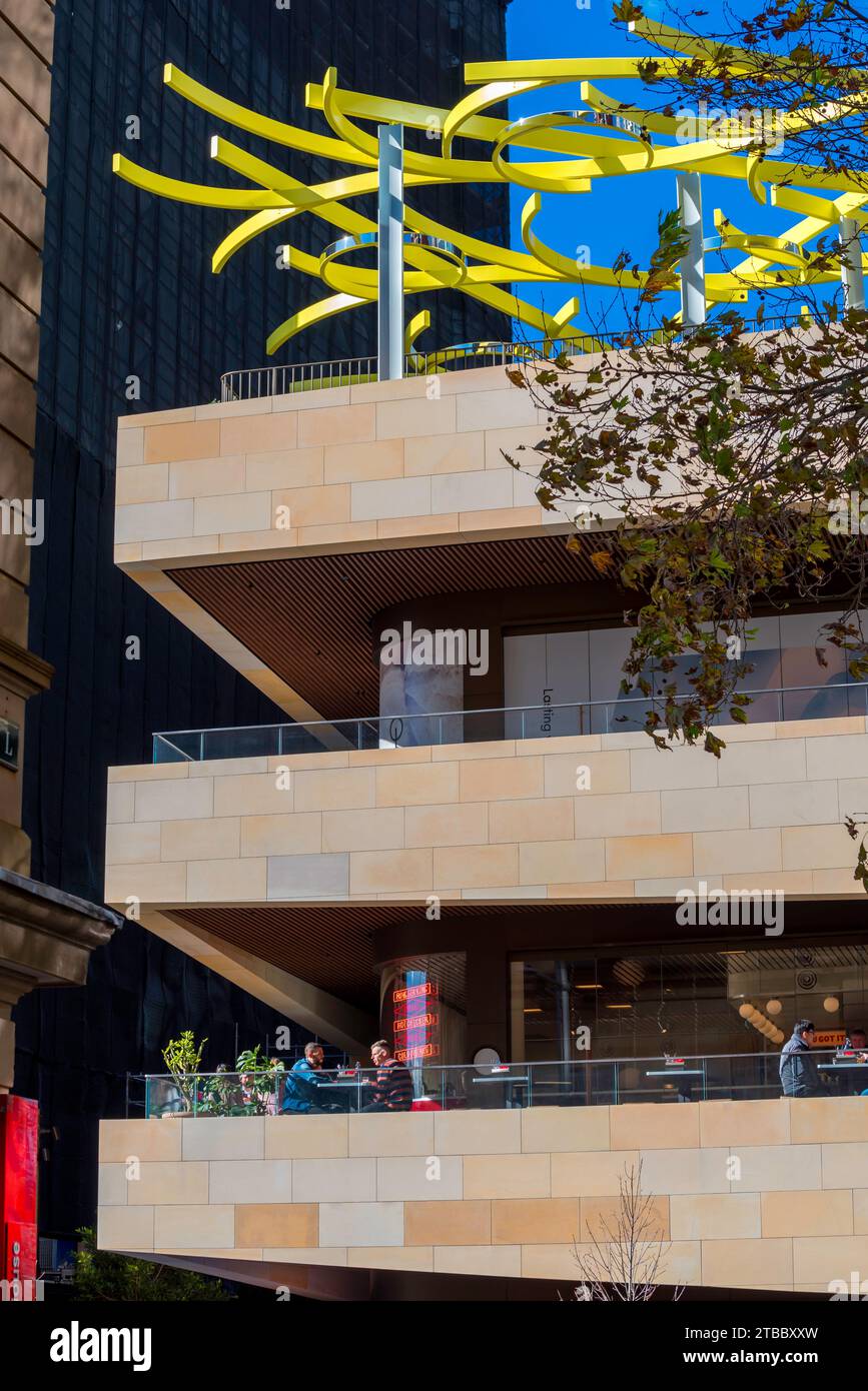 People eating lunch at one of the lower level balconies of the AMP Quay ...
