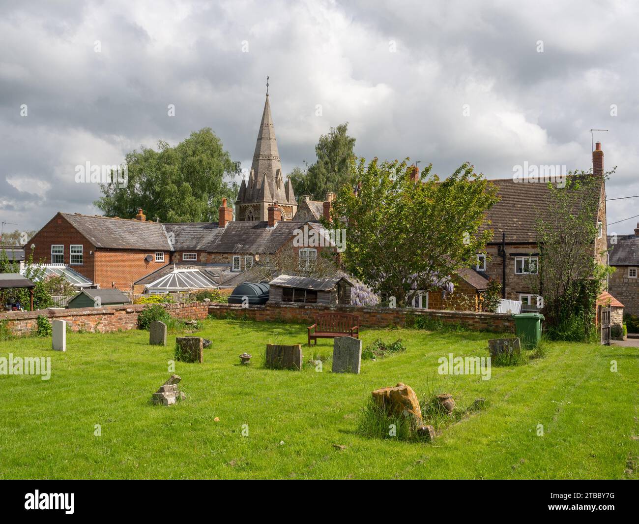 The churchyard in the village of Abthorpe, Northamptonshire, UK; with ...