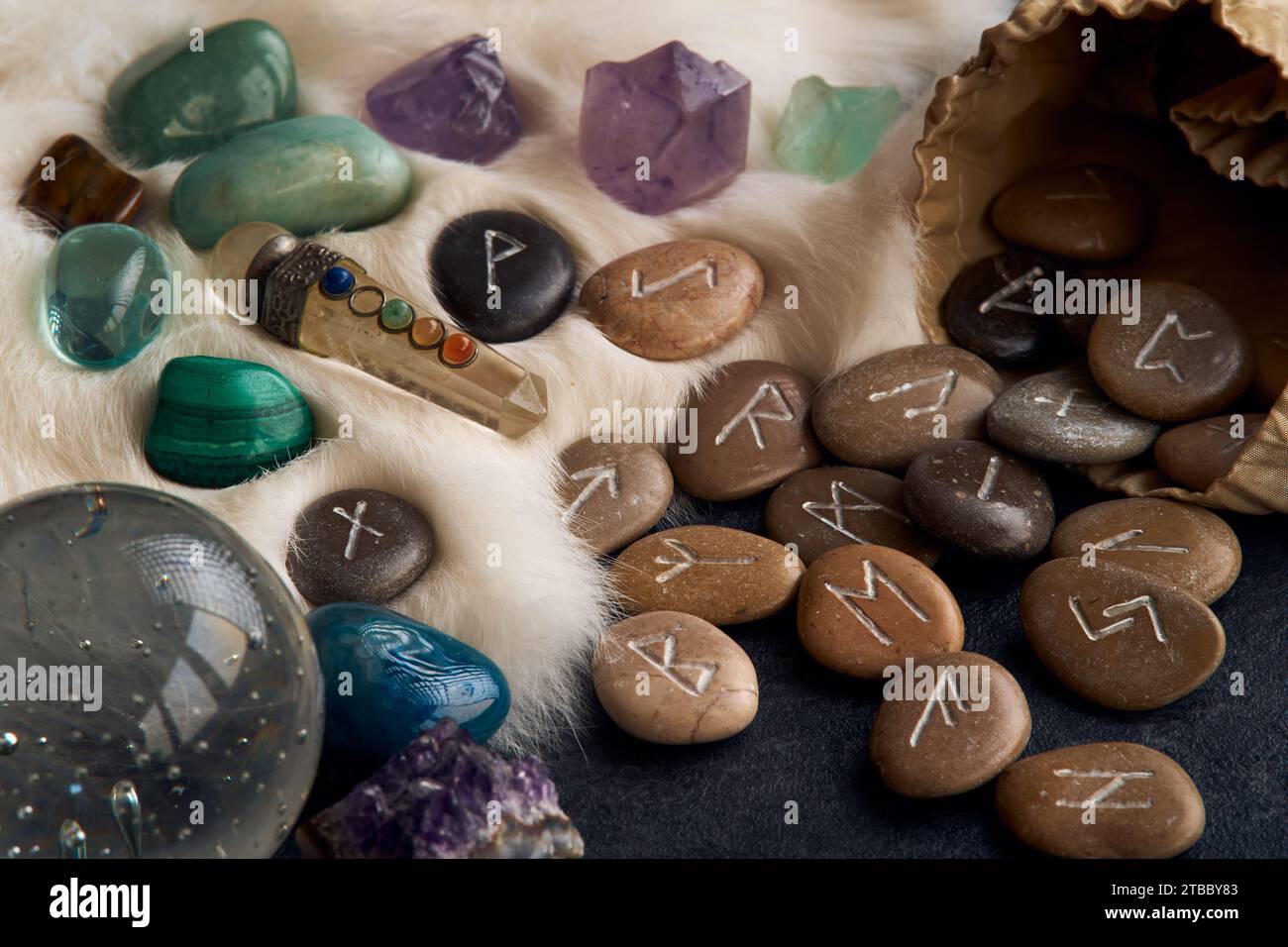 handmade stone runes on white fur Stock Photo - Alamy