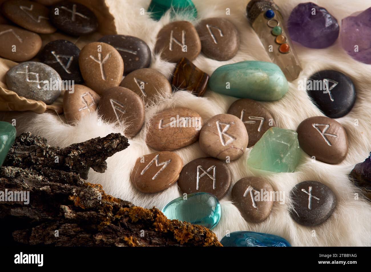 handmade stone runes on white fur Stock Photo - Alamy